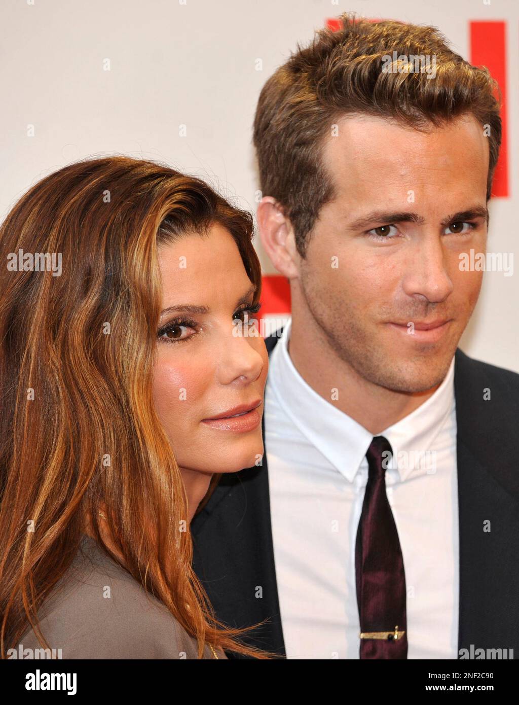 US actress Sandra Bullock, left, and actor Ryan Reynolds pose prior to ...