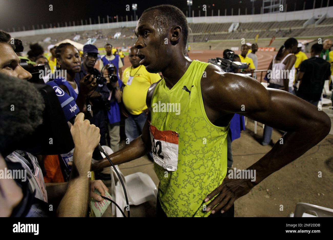 Olympic sprint double champion Usain Bolt of Jamaica, right, talks to ...