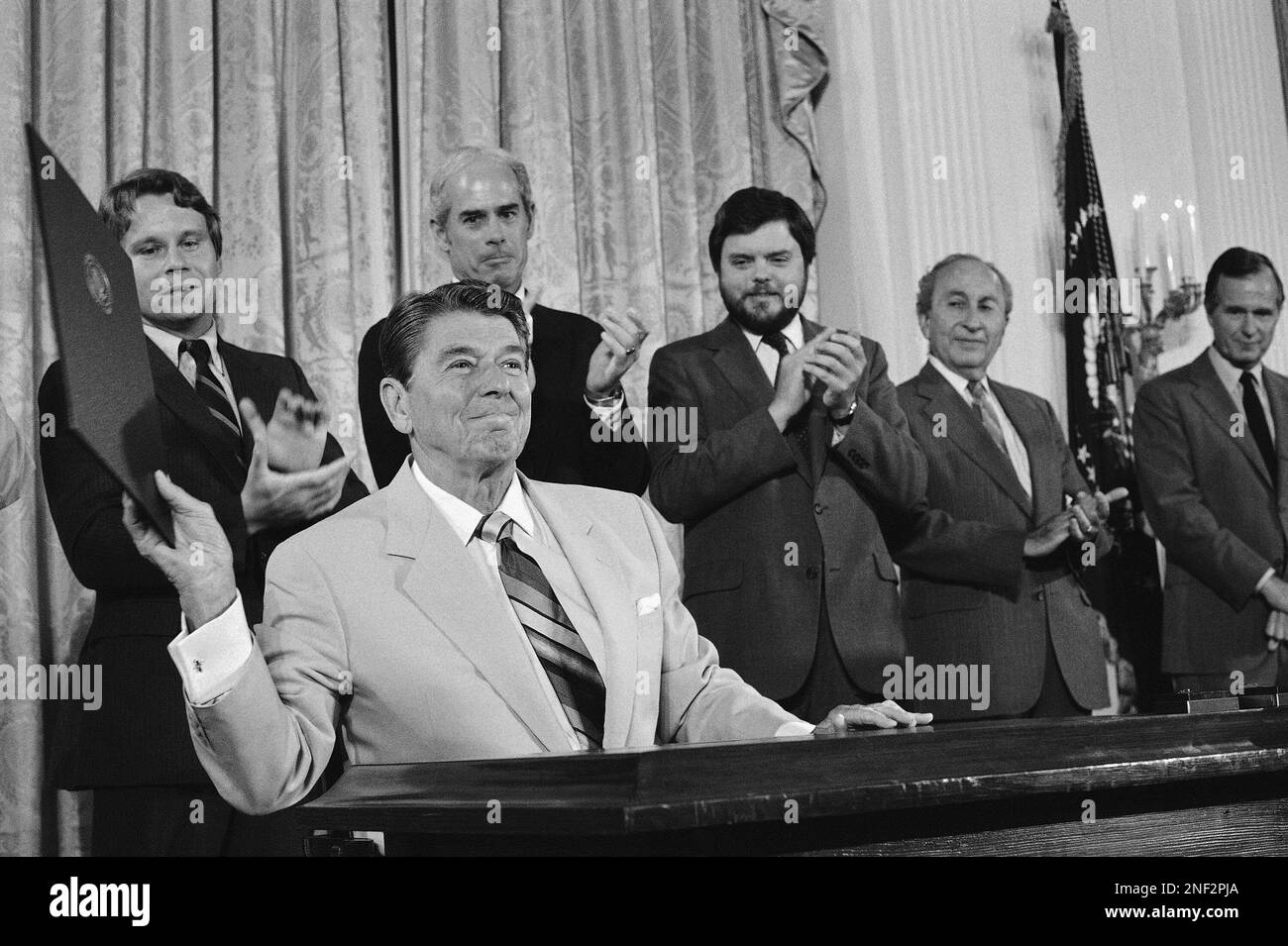 President Ronald Reagan holds up the Captive Nations Week Proclamation ...
