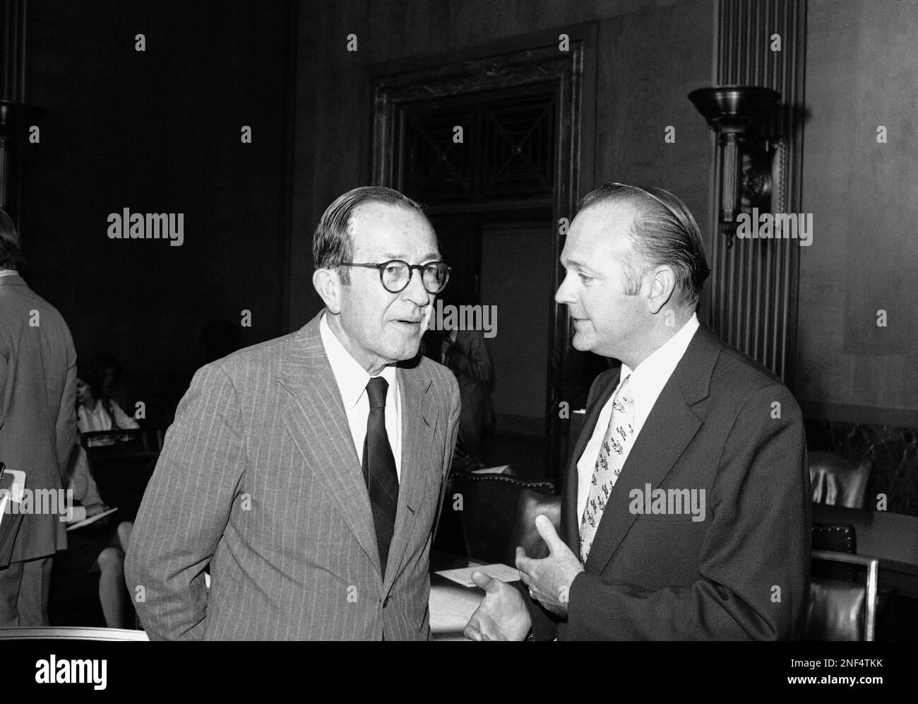 Attorney General Griffin Bell, left, chats with Sen. Dennis DeConcini ...