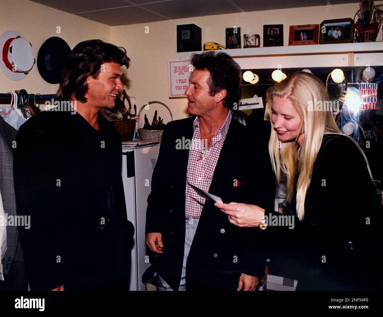 Actor Patrick Swayze, left, and his wife Lisa Niemi, right, pay a ...