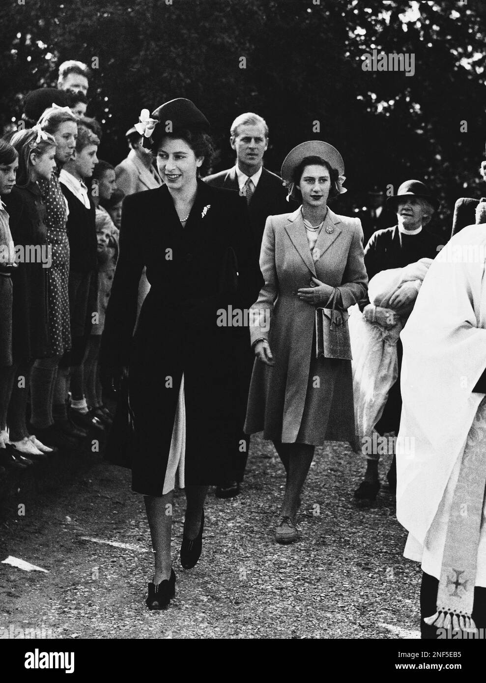 Princess Elizabeth, front, and Princess Margaret Rose, who follows, as ...