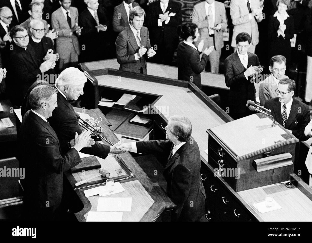 Pres. Jimmy Carter, center, reaches to shake hands with House Speaker ...