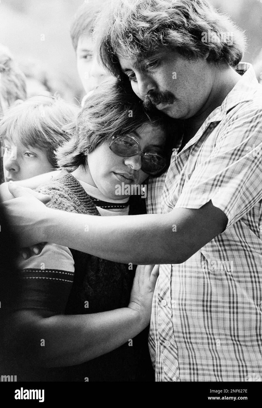 Gloria Aquino is comforted by her husband, July 21, 1984, at the ...