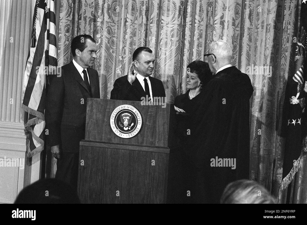 Walter J. Hickel takes his oath of office from Chief Justice Earl ...