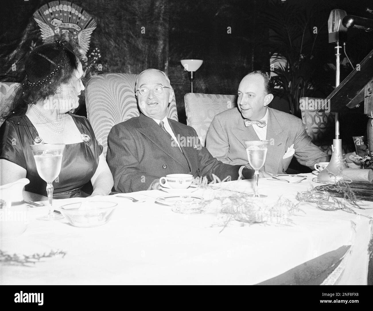 President Harry Truman, center, talks with Perle Mesta, left, as he ...