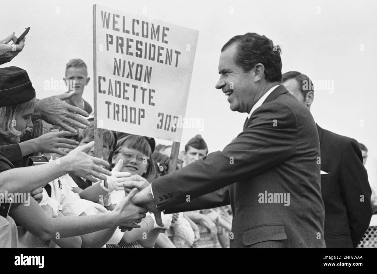 President Richard Nixon, right, shakes hands and chats with members of ...