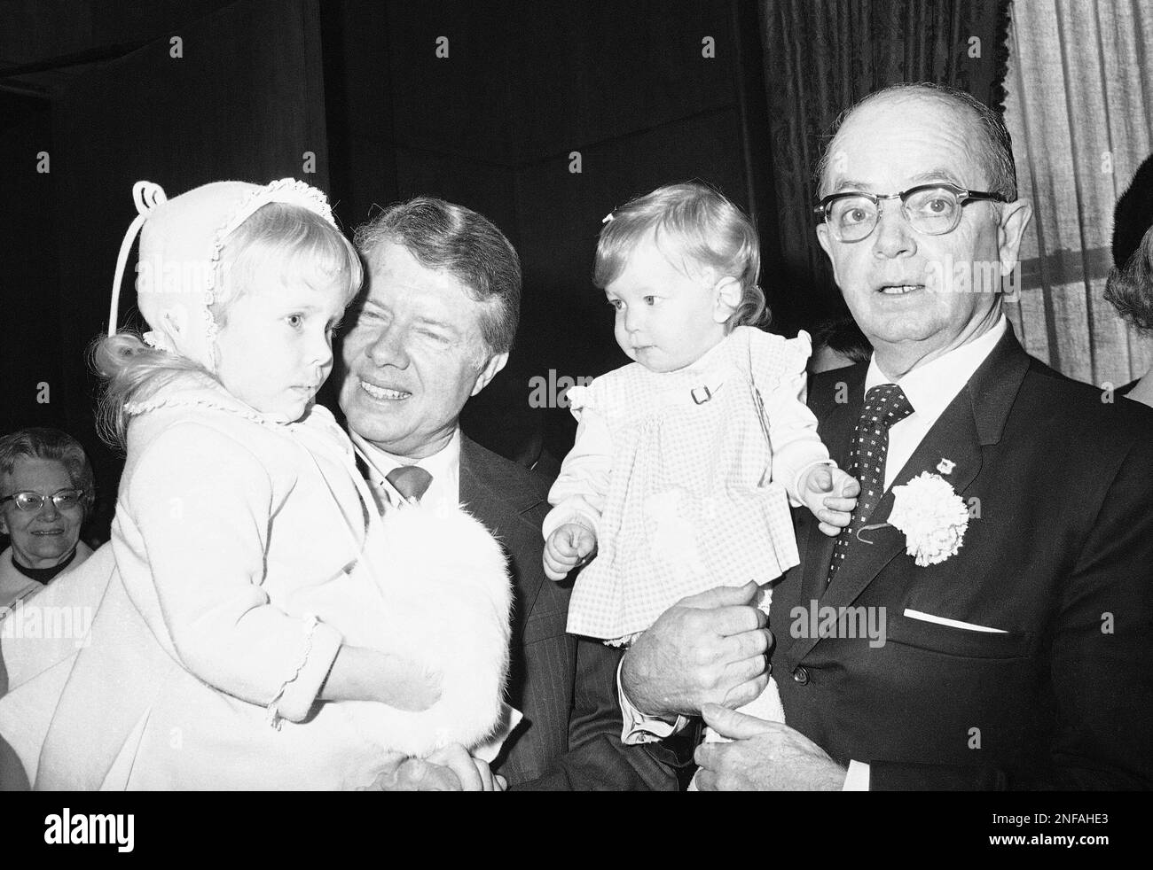 Governor-elect Jimmy Carter, left, holds his daughter Amy, 3, as ...