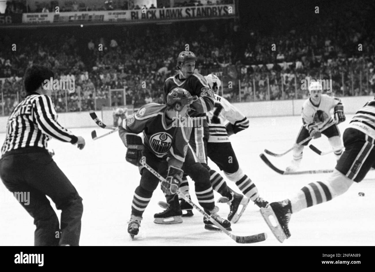 Edmonton Oilers' Wayne Gretzky (99) and Tom Roulston (24) watch the ...