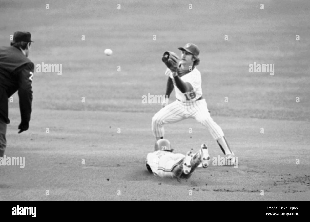 St. Louis Cardinals runner Lonnie Smith goes headfirst into second base ...