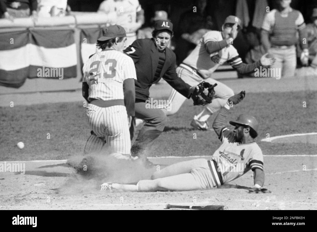 St. Louis Cardinals runner Lonnie Smith, right, slides safely into home ...