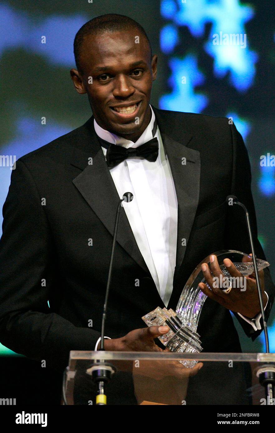 Jamaican sprinter Usain Bolt poses for photographers with his "Athlete ...