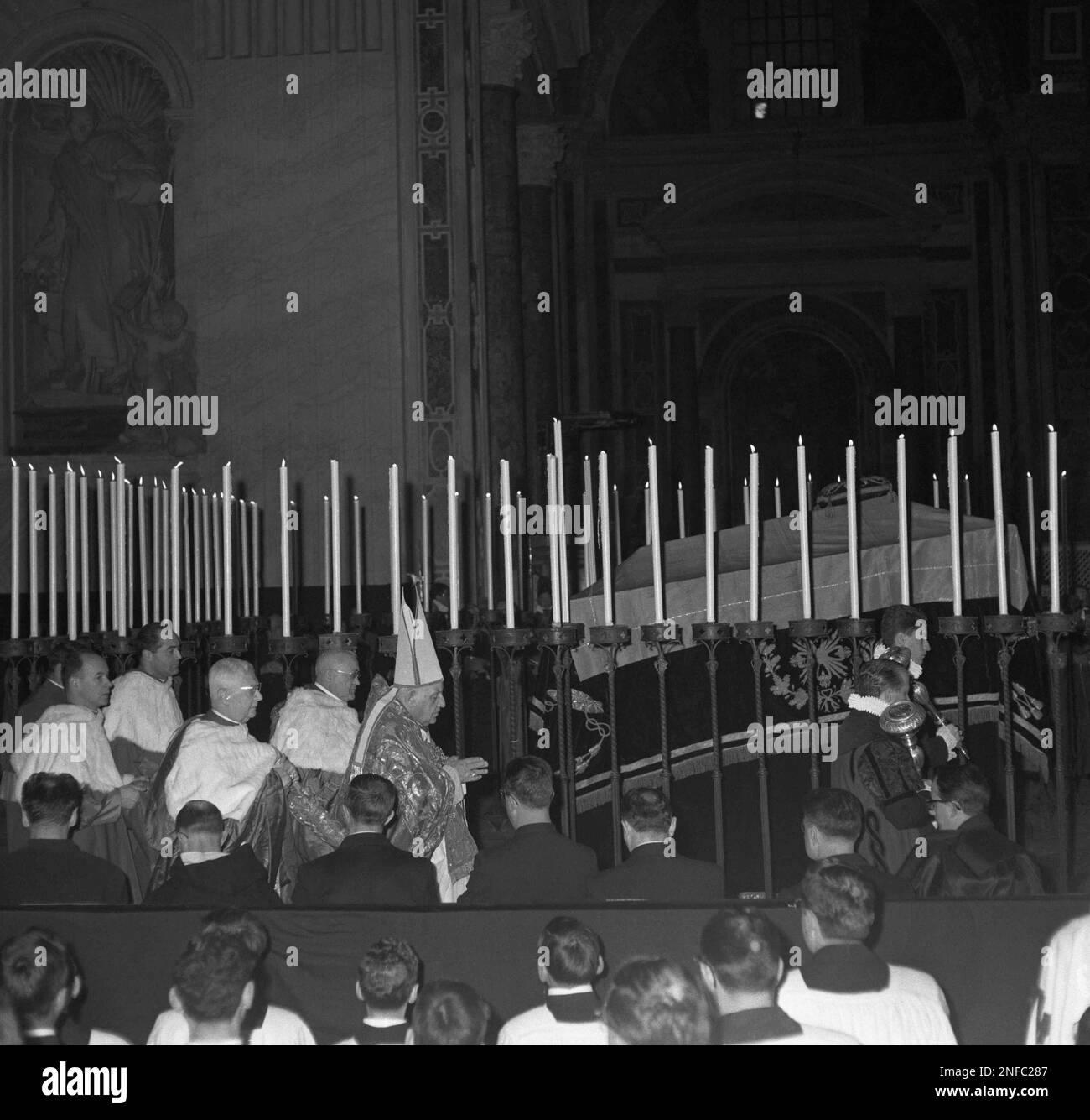 Pope John XXIII, center, wearing mitre, passes the catafalque with the ...
