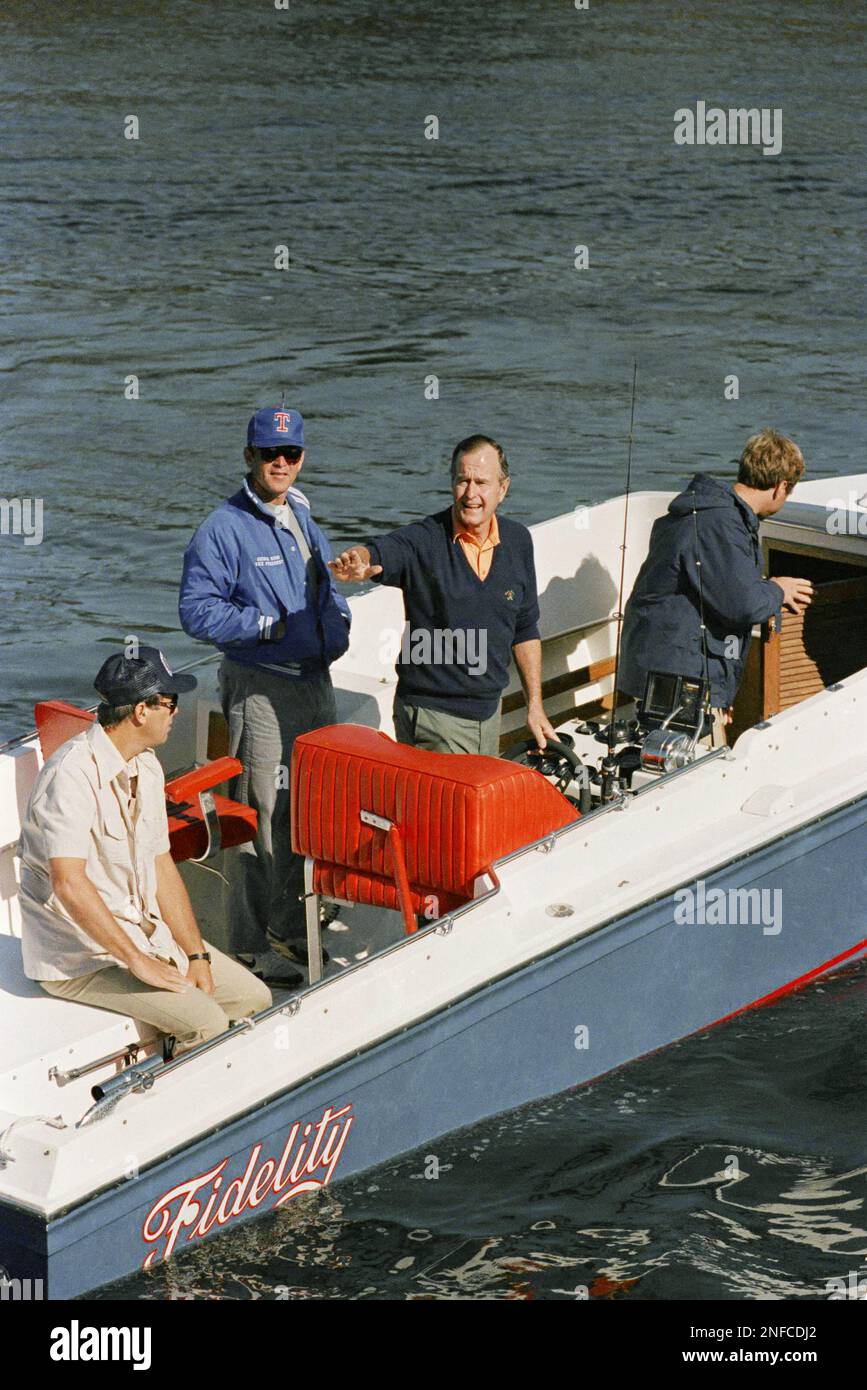 President George Bush waves as he leaves the dock at Biddeford Pool ...