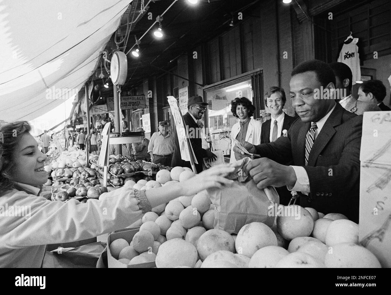 Democratic mayoral candidate W. Wilson Goode pauses to buy some fruit ...