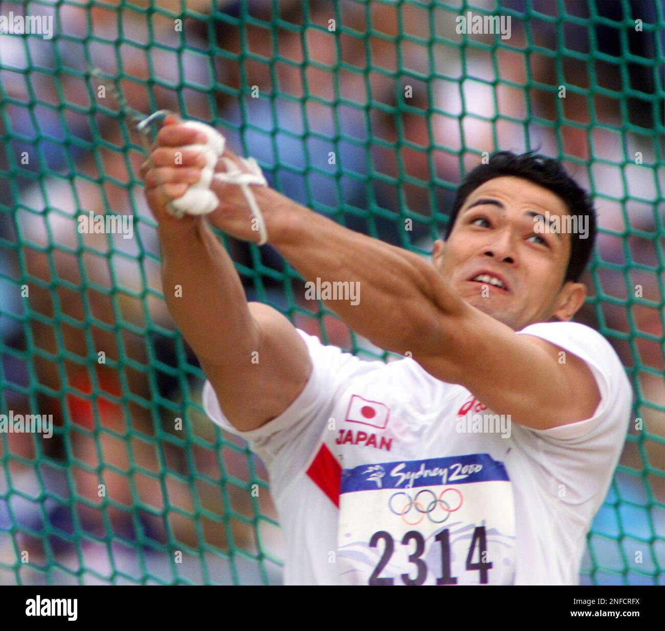 Japan's Koji Murofushi competes in a qualifying heat of the hammer ...