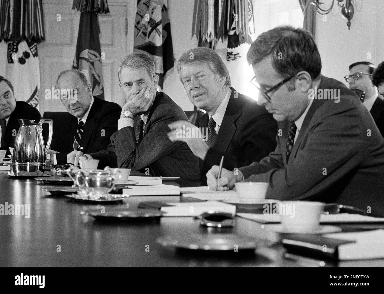 President Jimmy Carter, flanked by members of his cabinet, discusses ...