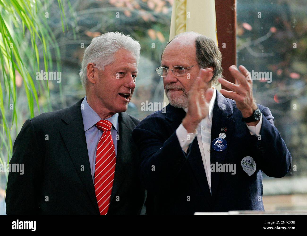 Former President Bill Clinton speaks to Gov. Jon S. Corzine, right, at ...