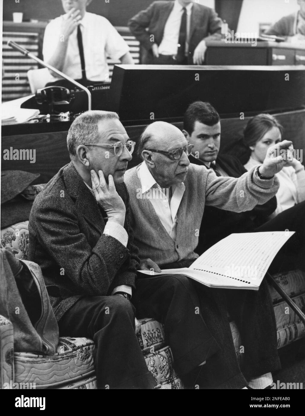 Russian composer Igor Stravinsky, center, gestures pointing with his ...