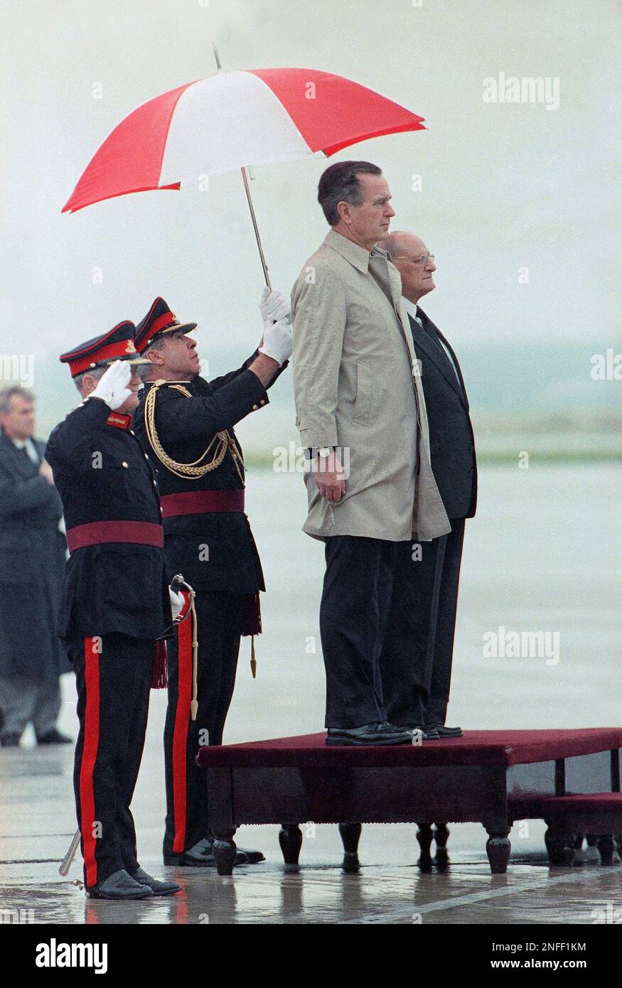 President George H.W. Bush, center left, reviews the honor guard on his ...