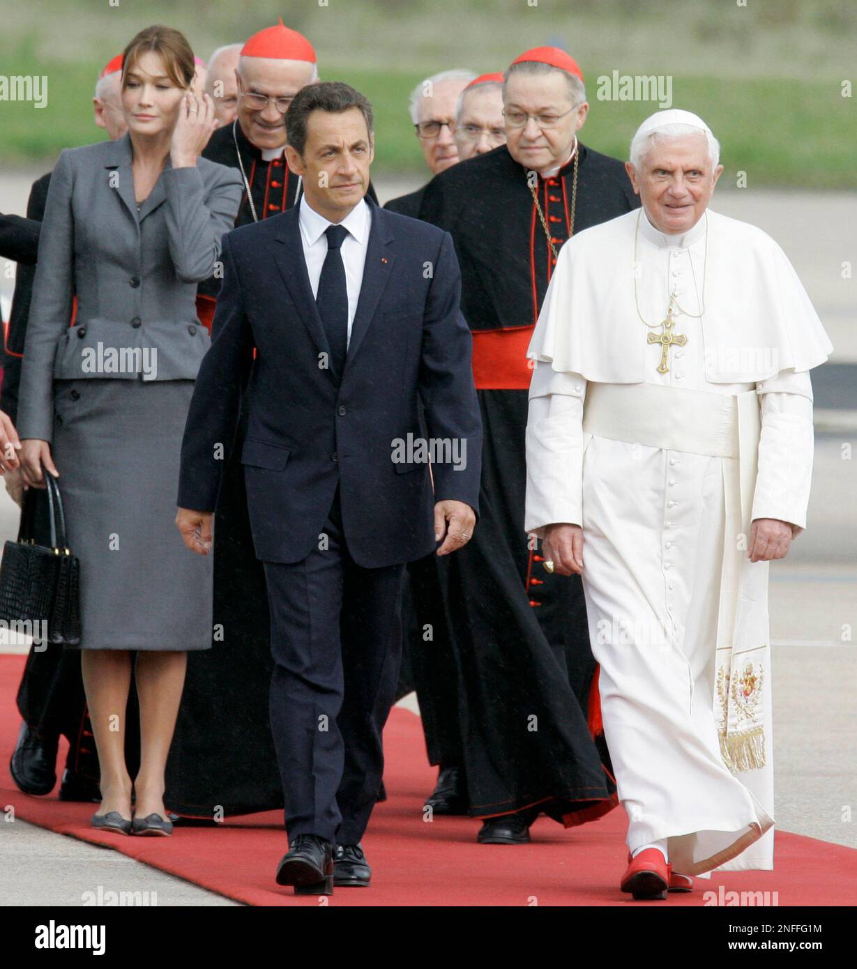 French President Nicolas Sarkozy, foreground left, and his wife Carla ...