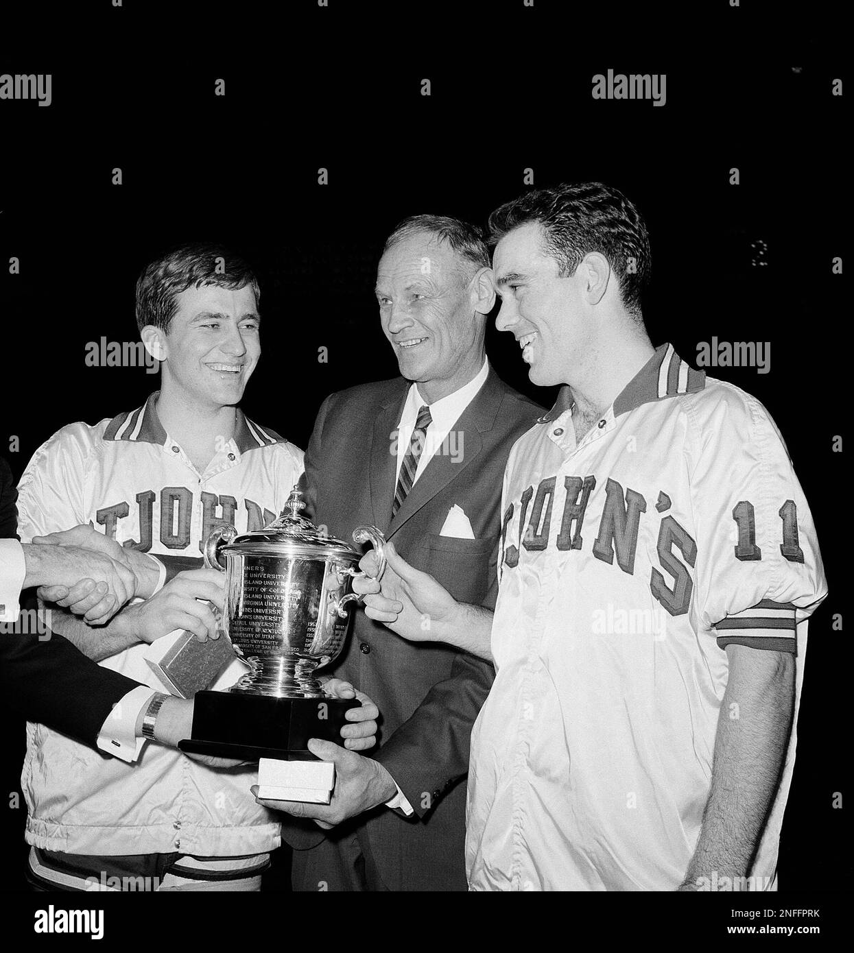 Ken Mcintyre, left, and Jerry Houston, right join Coach Joe Lapchick in ...