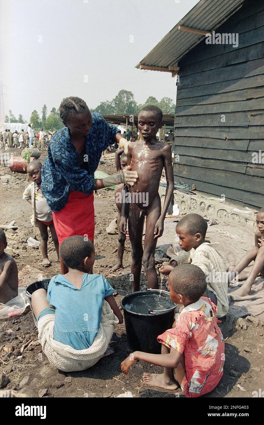 Rwandan refugee orphans sit in the sun without clothes at S.O.S ...