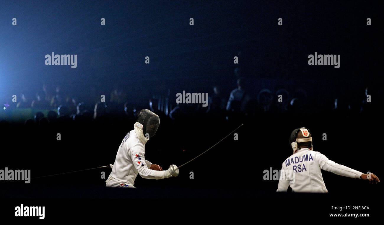 South Korea's Seung Gu Kim, left, and South Africa's Sello Maduma ...