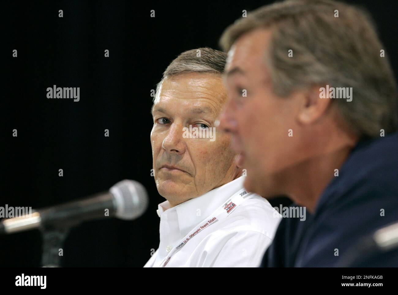 US National Swimming Team Head Coach Mark Schubert listens to Chuck ...