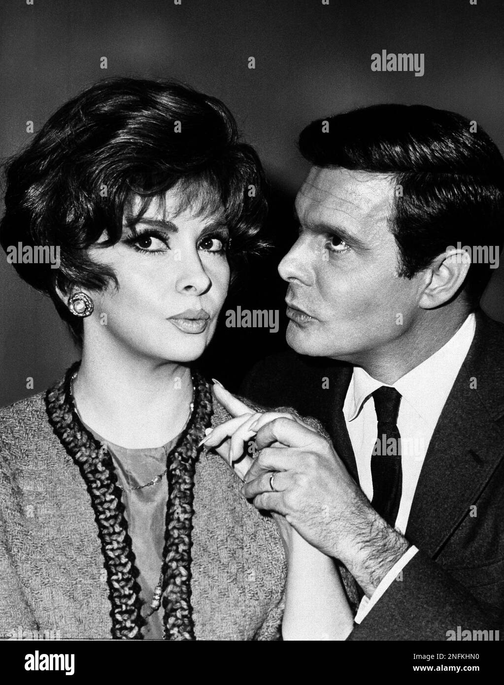 Gina Lollobrigida and Louis Jourdan hold hands as they act out a scene ...