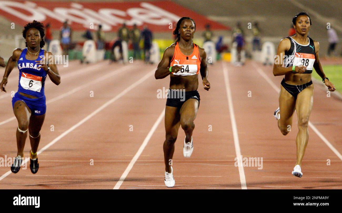Veronica Campbell-Brown, center, wins her heat of the 100 meters sprint ...