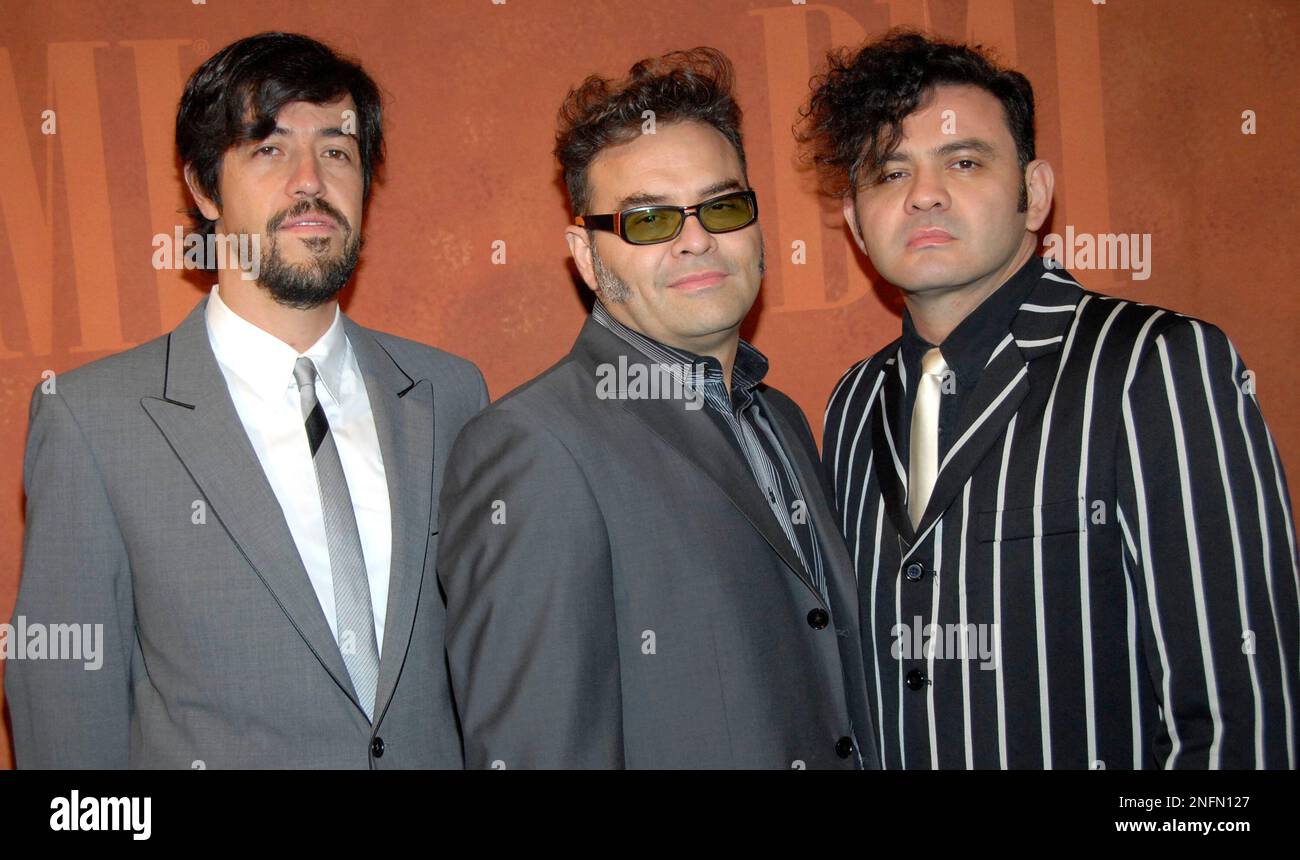 Members of the Mexican rock band Cafe Tacuba pose for photographers as ...