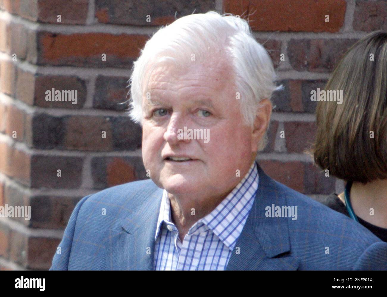 Sen. Edward M. Kennedy, D-Mass., waves as he walks out of at the ...