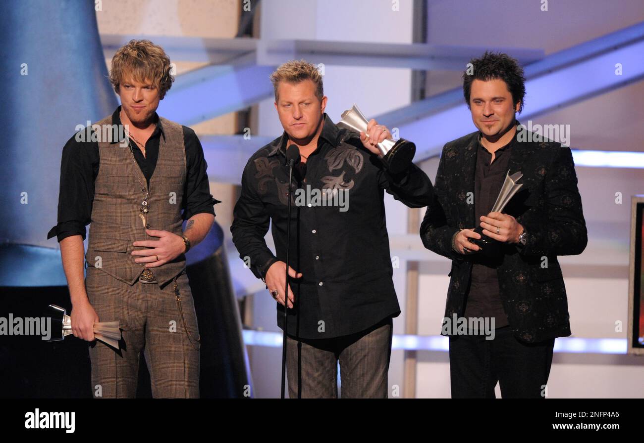 Rascal Flatts accepts the award for top vocal group at the 43rd Annual ...