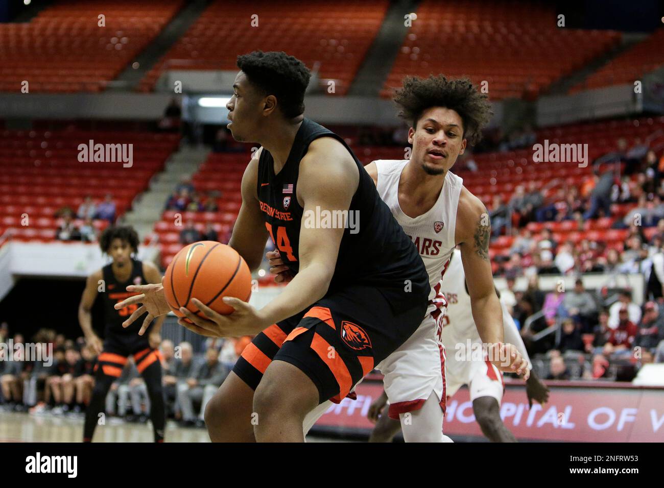 Oregon State center KC Ibekwe, left, controls the ball while defended ...