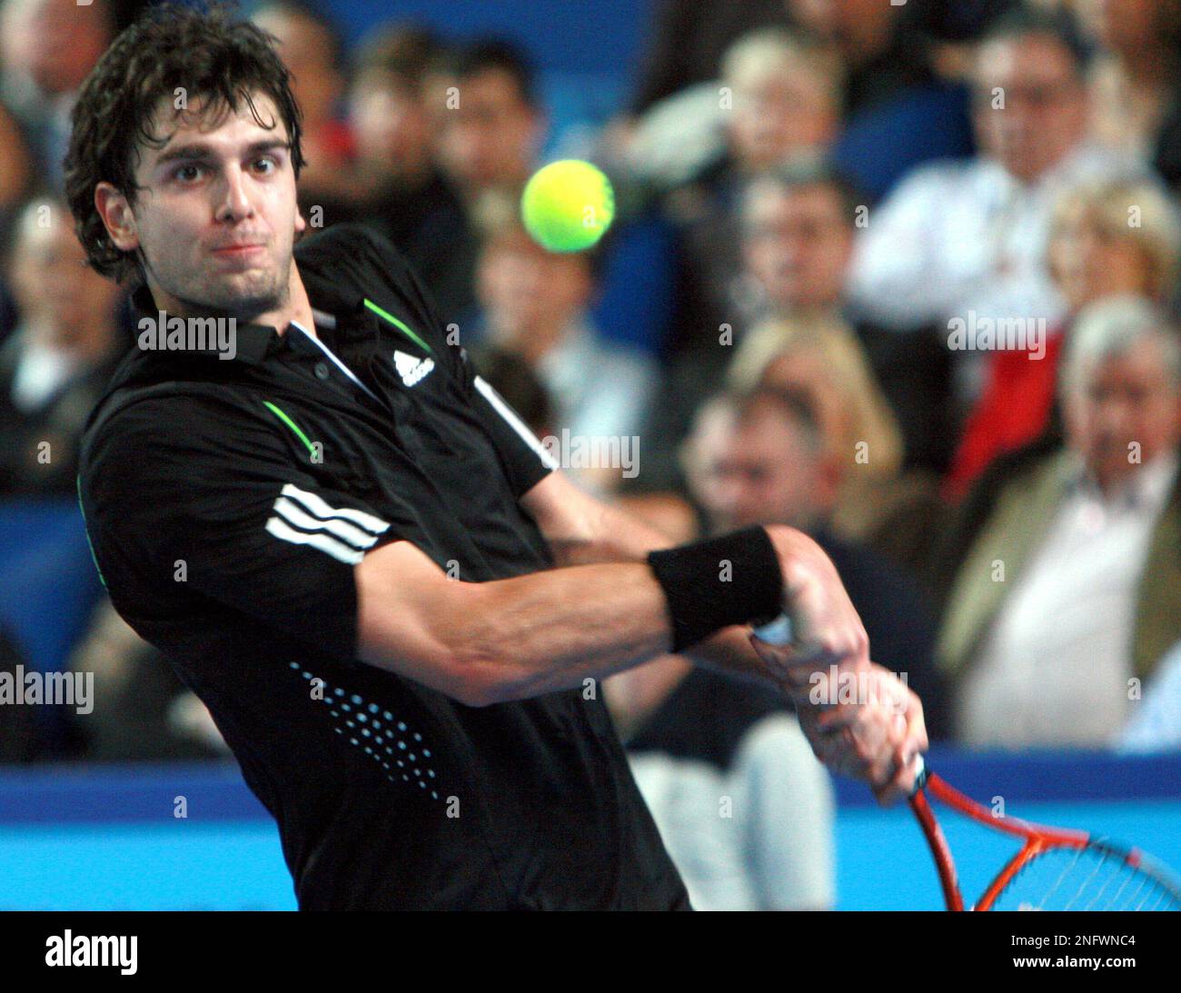 Croatia's Mario Ancic returns a ball to Britain's Andy Murray during ...