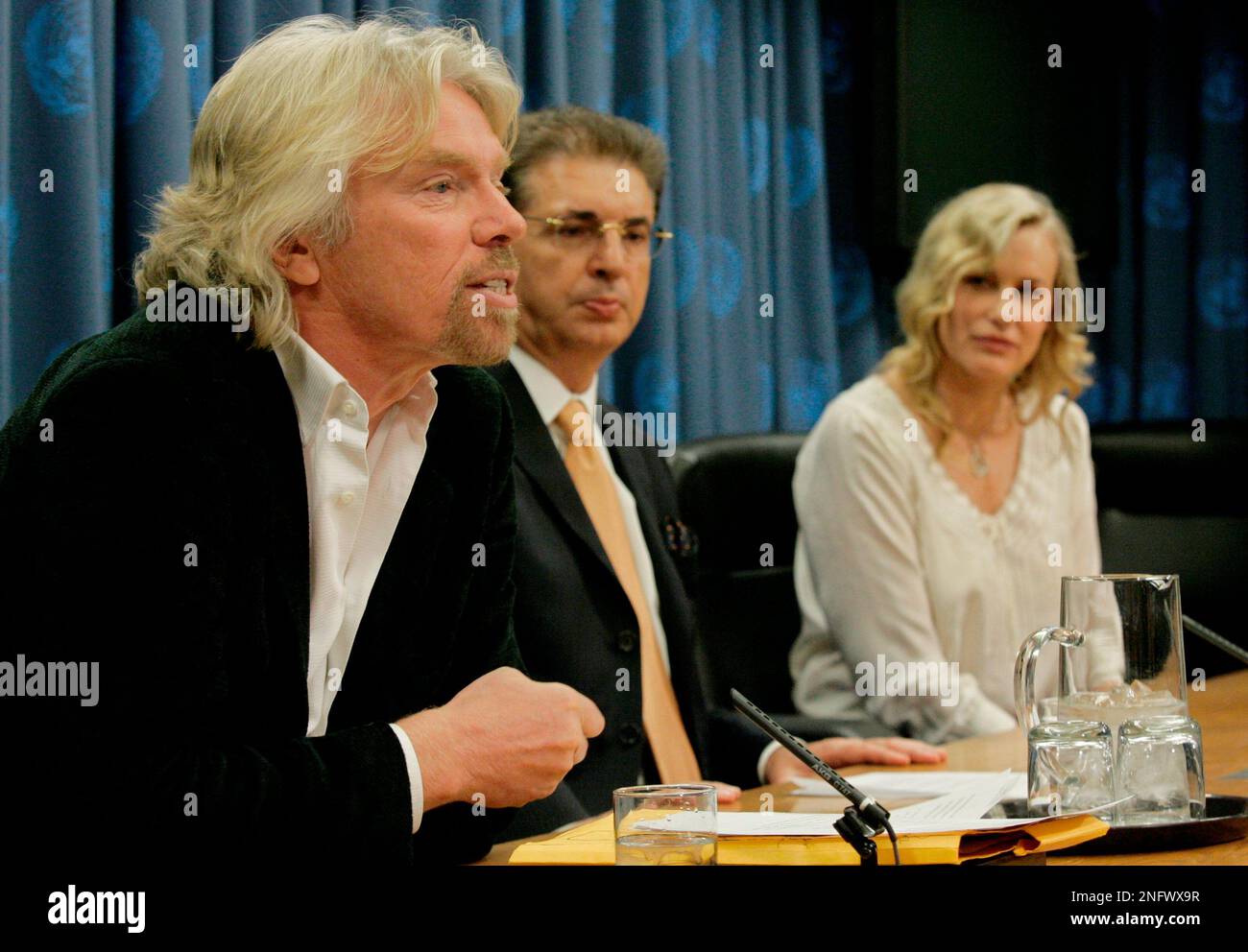 Sir Richard Branson, left, CEO of Virgin Group, speaks about climate change as actress Daryl ...