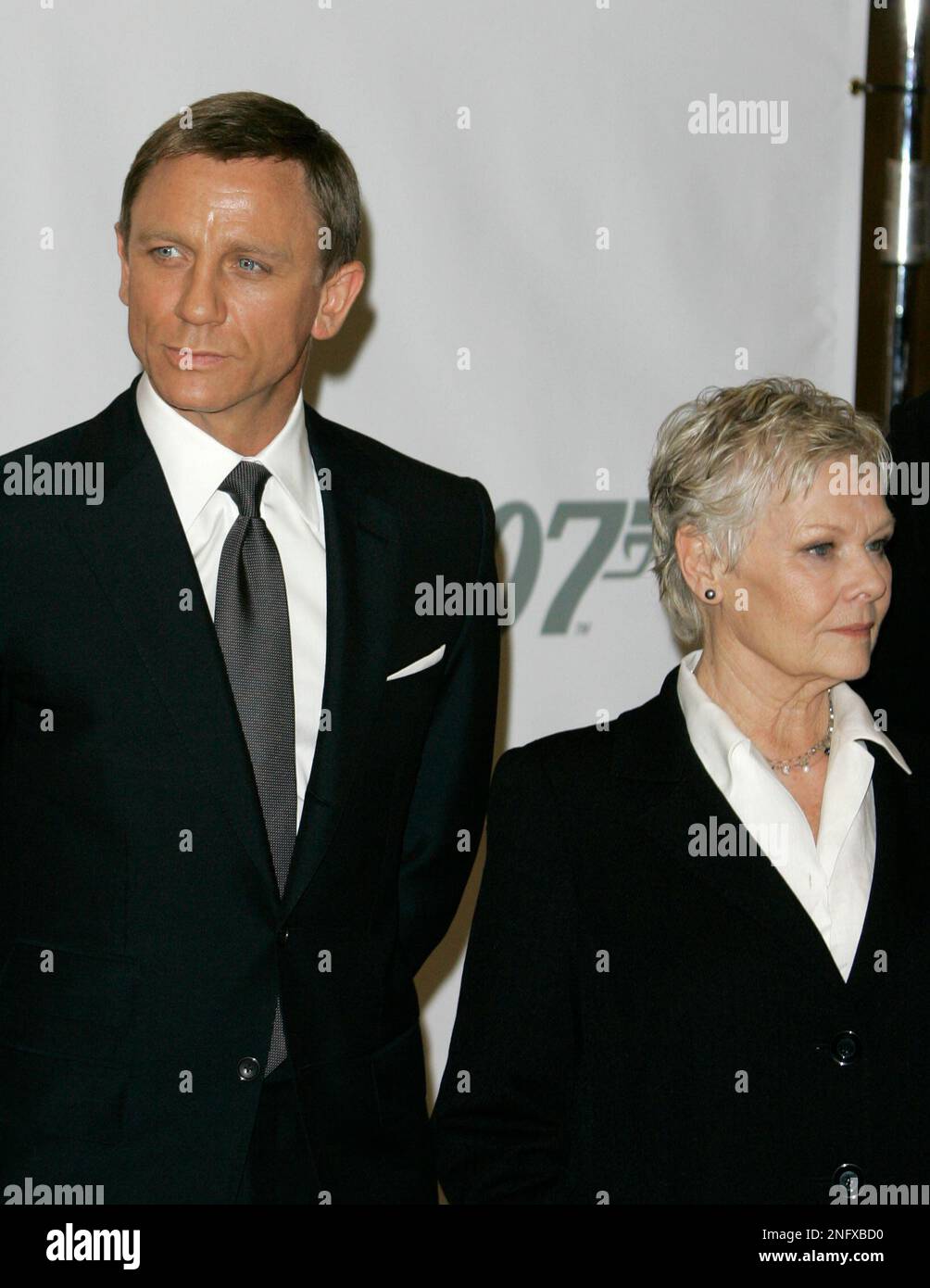 British actors Daniel Craig who plays James Bond and Judy Dench who ...