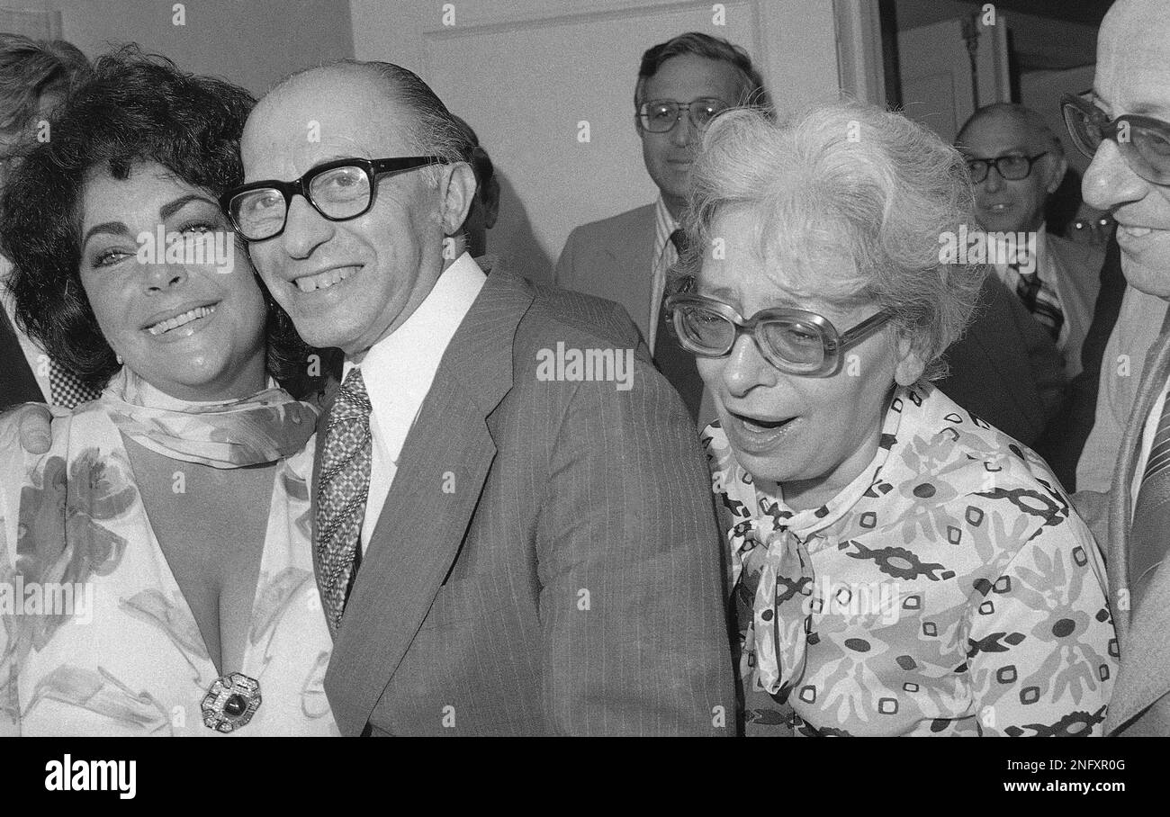 Israeli Prime Minister Menachem Begin embraces actress Elizabeth Taylor ...