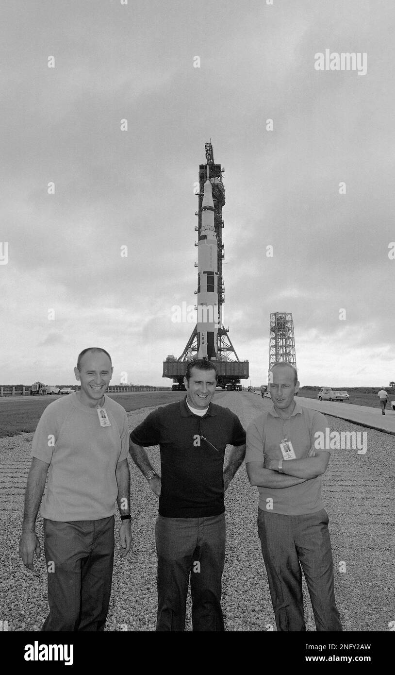 Apollo 12 moon mission crewmen pose in front of their Saturn 5 space ...