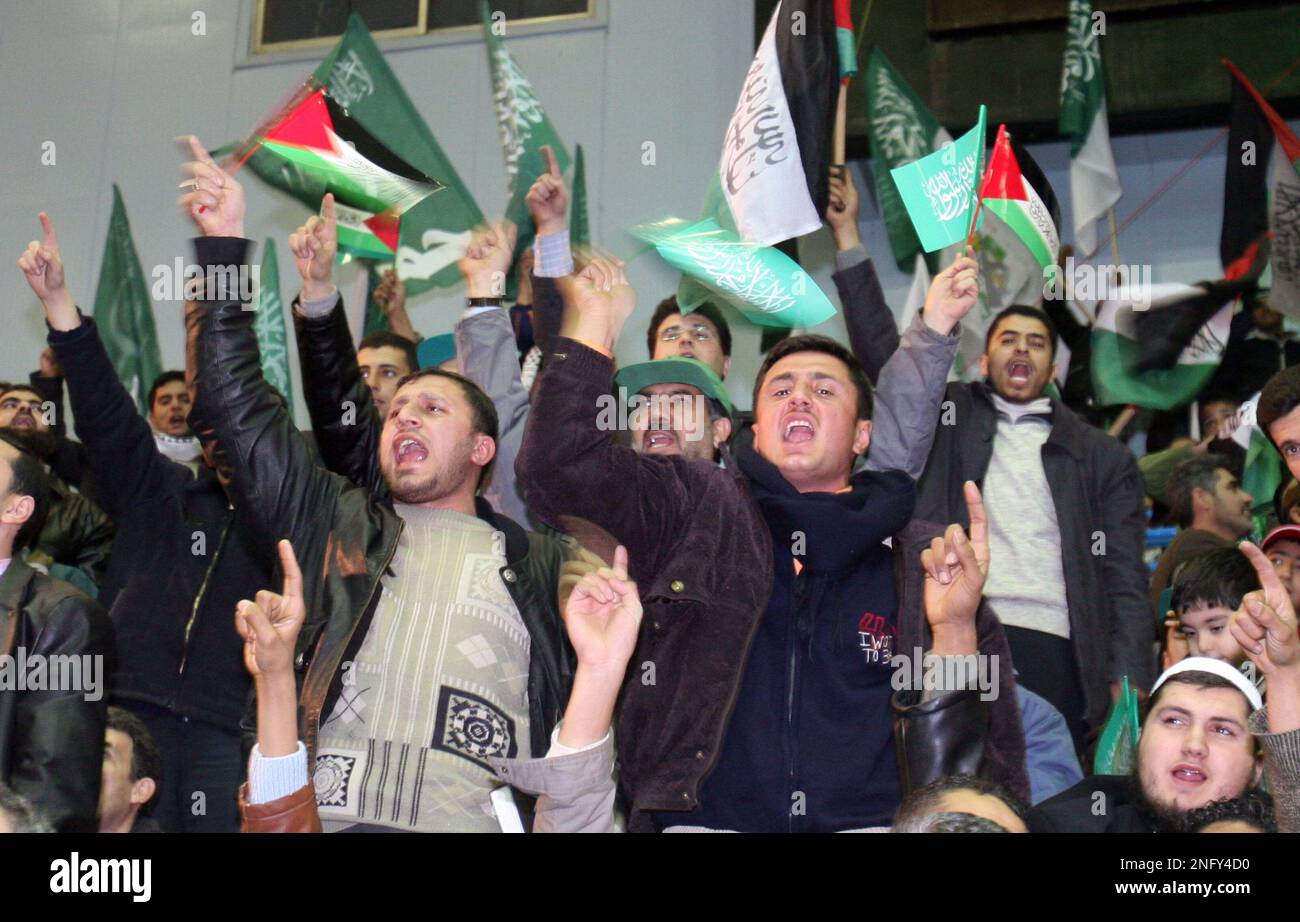 More than 5,000 of the Islamic Hamas movement's followers wave ...