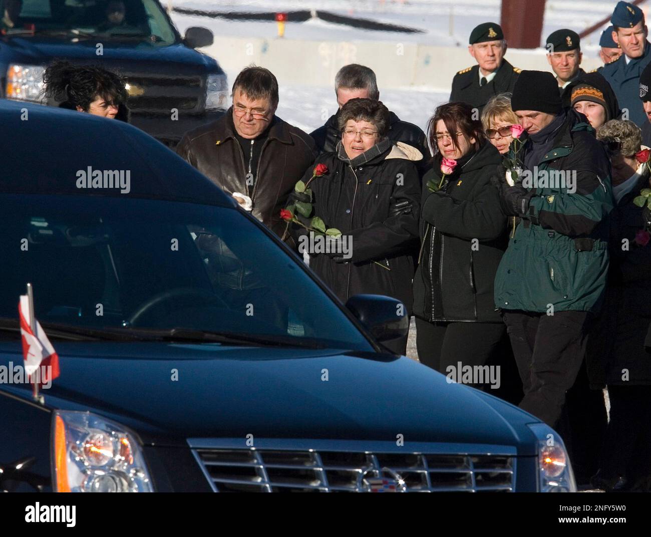 Lise Marcil, mother of fallen soldier gunner Jonathan Dion, is consoled ...