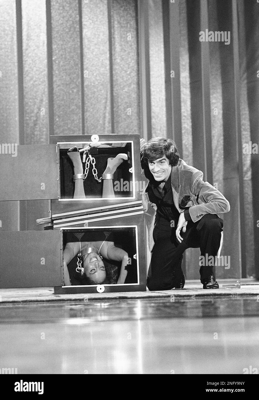 Actress Catherine Bach appears to be upside down and cut in half as ...