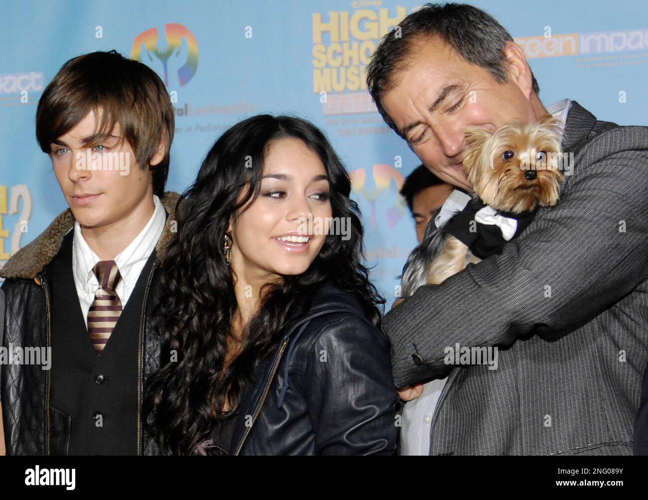 "High School Musical 2: Extended Edition" director Kenny Ortega and his dog Manly pose with cast ...