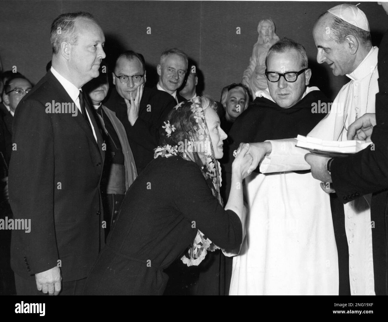Mrs. Patrick Crowley of Chicago kneels to kiss the papal ring of Pope ...