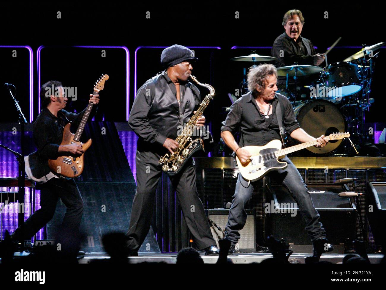 Bruce Springsteen, right, and members of his E Street Band perform in ...