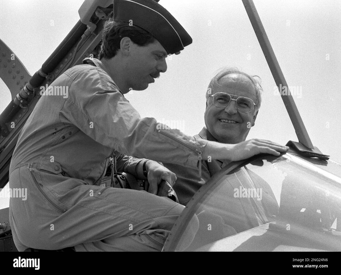 West German Chancellor Helmut Kohl, right, sits in the cockpit, of a ...