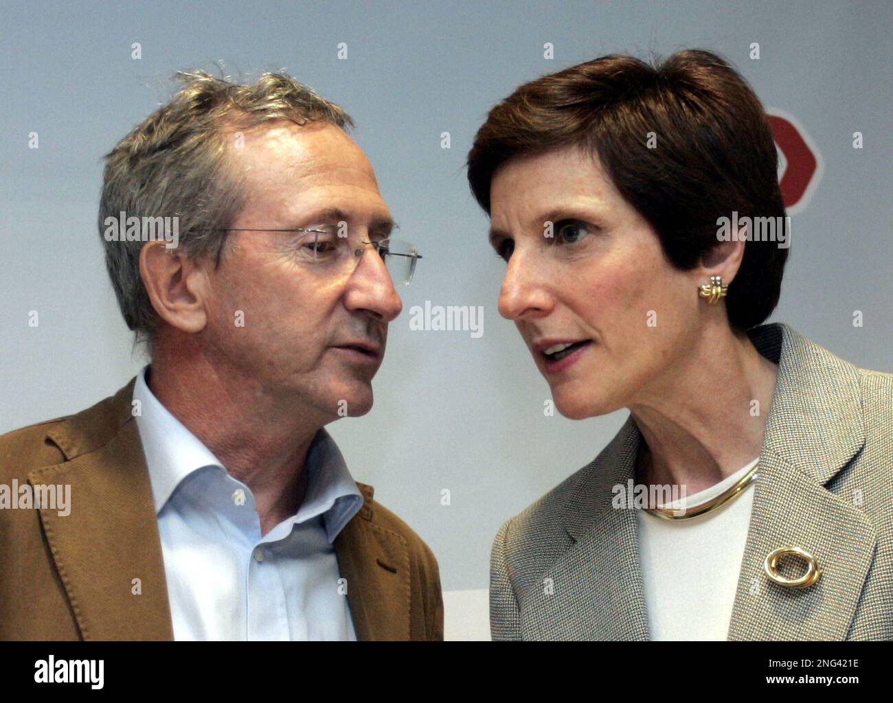 Danone Chief Executive Franck Riboud, left, talks to Kraft Food ...