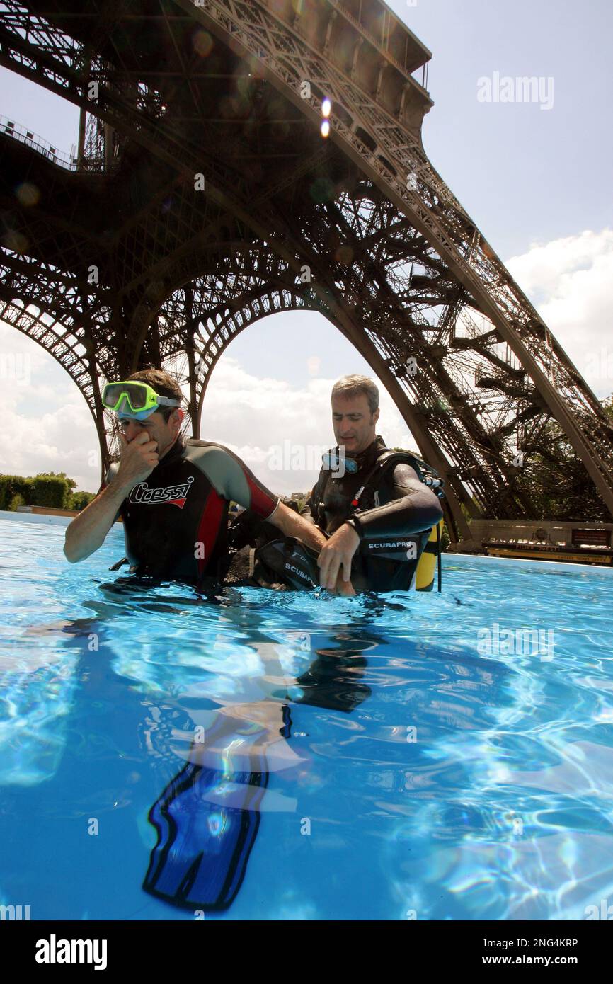 Professional scuba instructor Patrick Houdebine, right, and an ...
