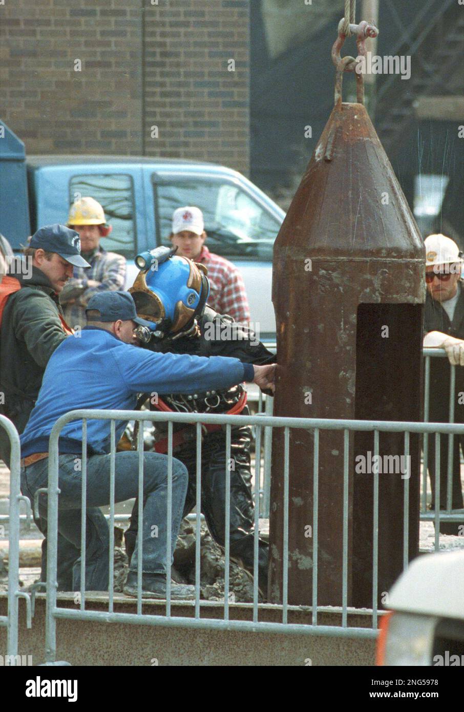 Diver Jim Samoska is helped out of a lift, April 16, 1992, after ...